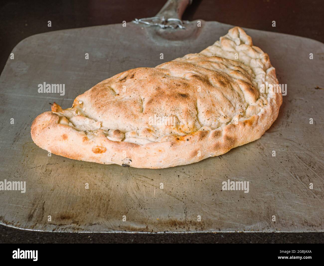 Fresh Folded Pizza From The Oven Stock Photo - Alamy