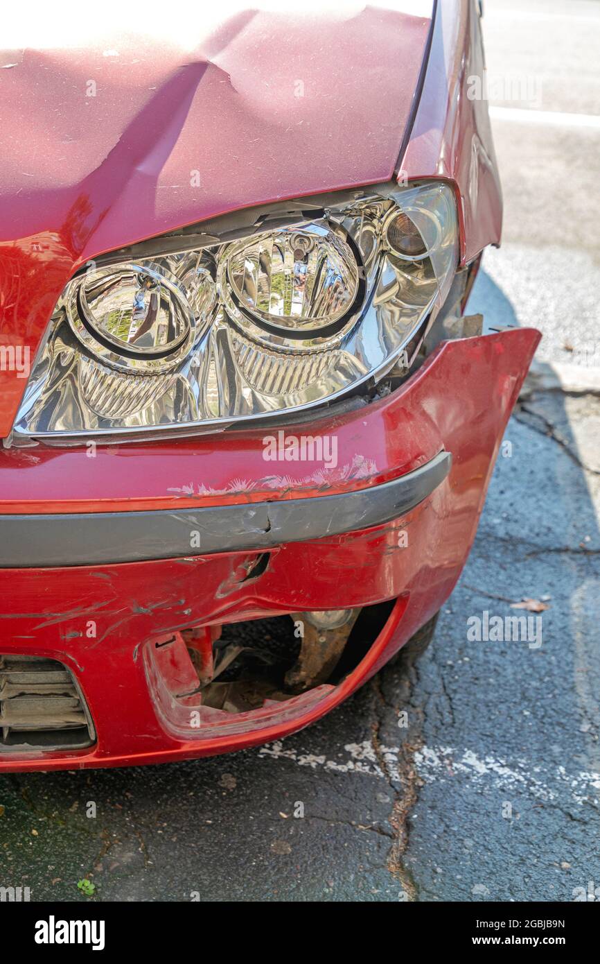 Broken Headlight and Bumper at Small Car Front Stock Photo - Alamy