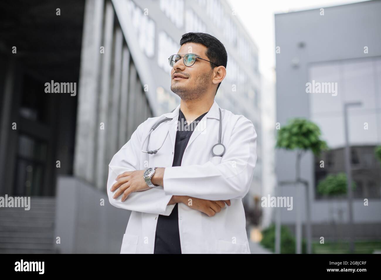 Close up portrait of young professional male Arabian doctor, wearing ...