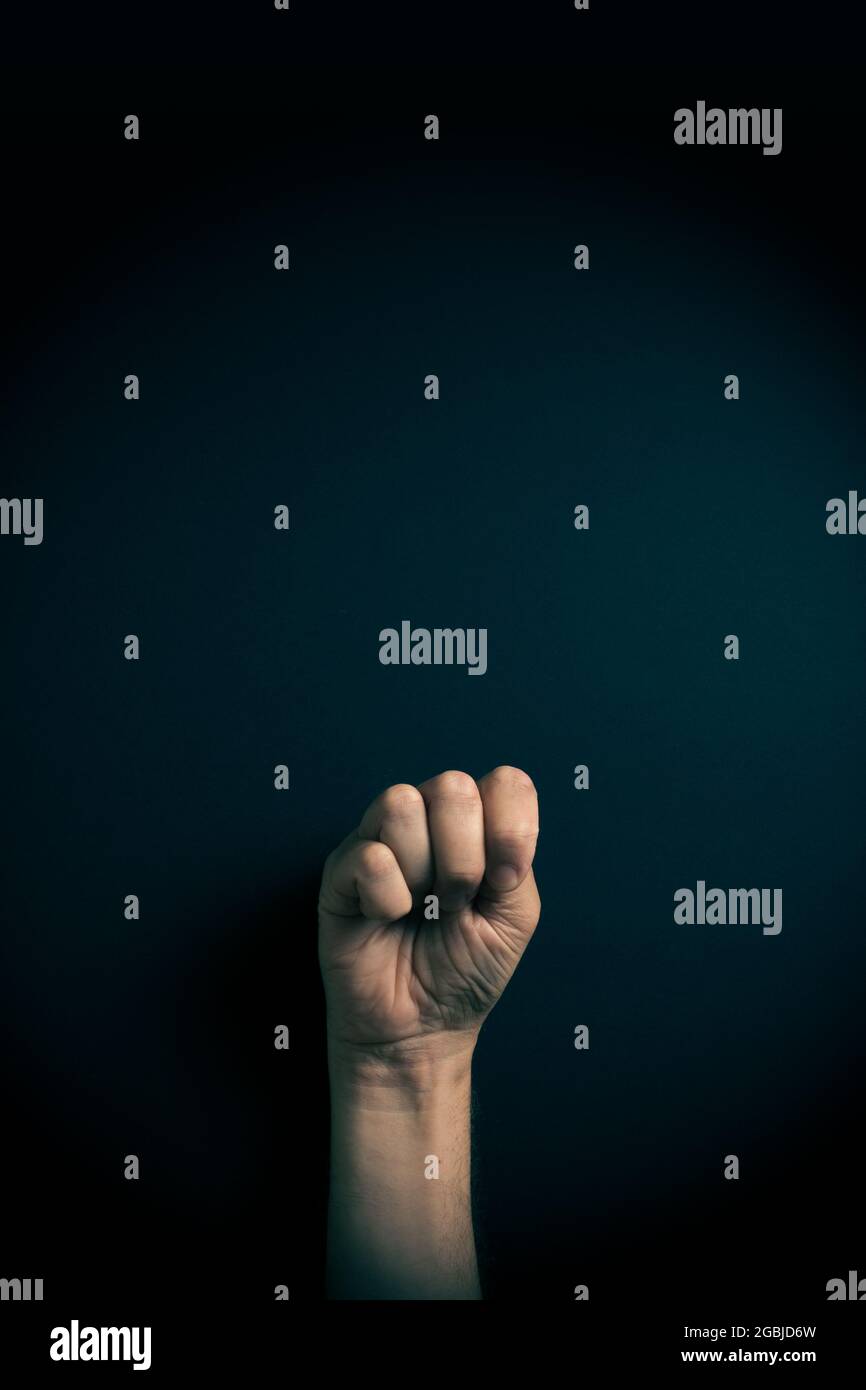 Dramatic colour image of male hand demonstrating ASL American sign ...