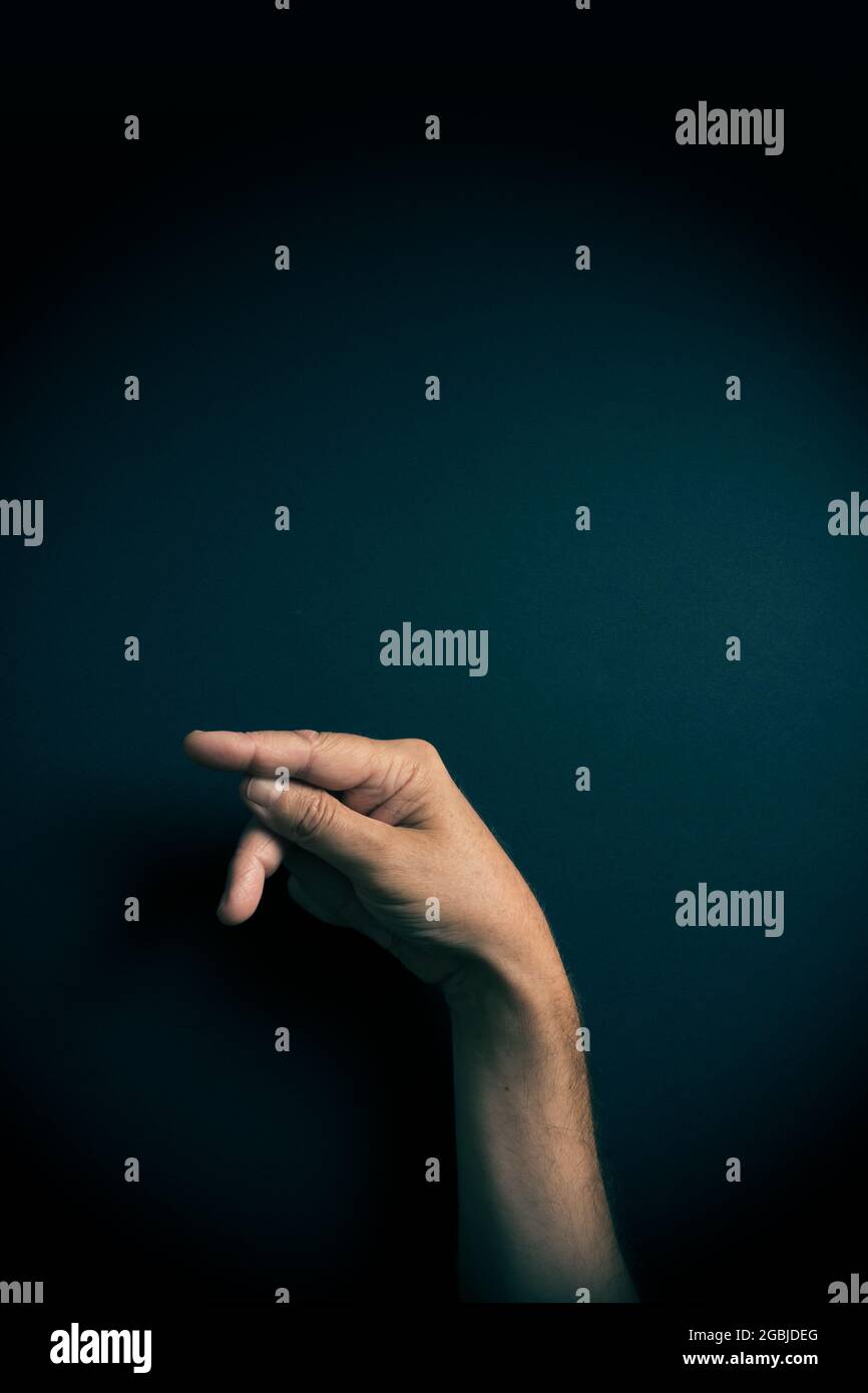 Dramatic colour image of male hand demonstrating ASL American sign ...
