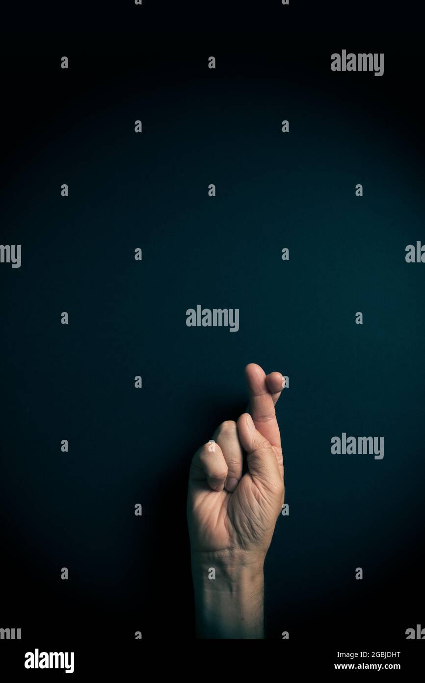 Dramatic colour image of male hand demonstrating ASL American sign ...