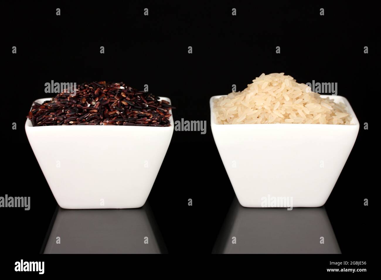 Black & white rice isolated on black Stock Photo - Alamy