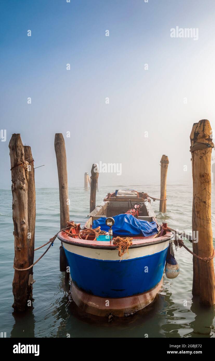 Fishing Boat In The Morning Mist In Venice Stock Photo - Alamy