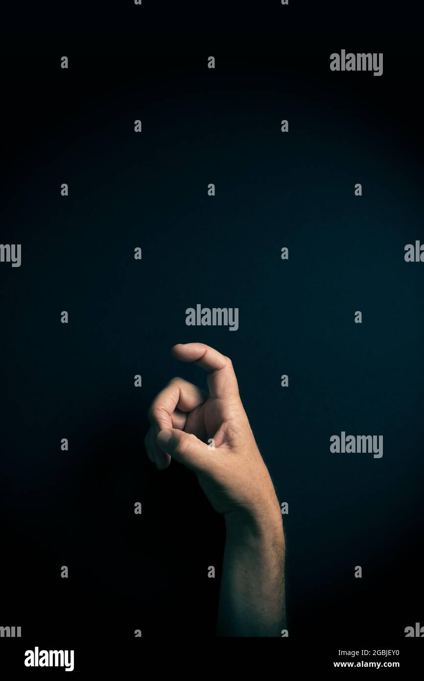 Dramatic colour image of male hand demonstrating ASL American sign ...