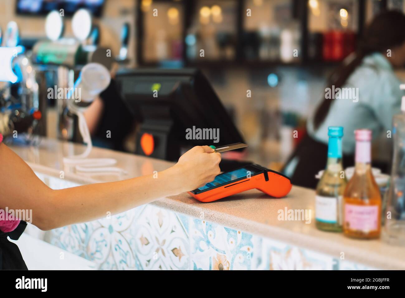 Contactless payment from card via pos terminal Stock Photo - Alamy