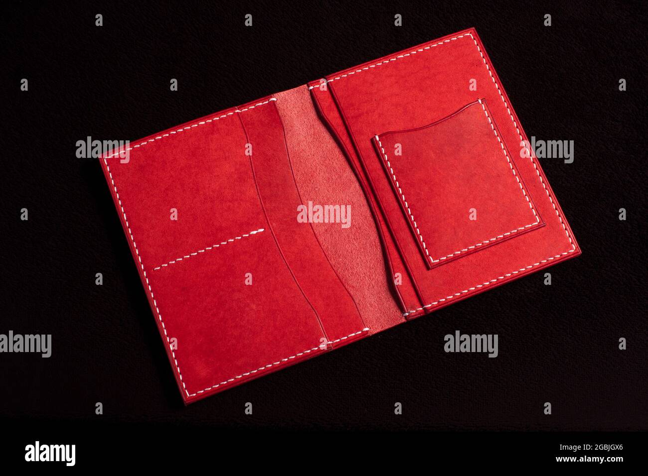 Open leather red purse with pockets on a dark background Stock Photo ...