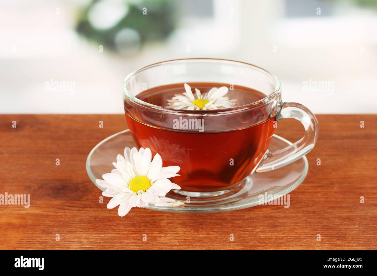 Camomile tea in cafe Stock Photo - Alamy