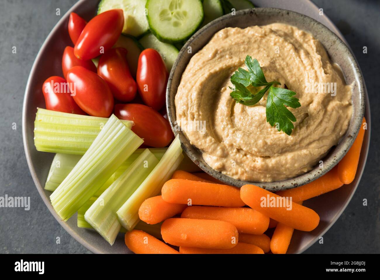 Healthy Homemade Veggie Hummus Plate with Carrot Tomato and Celery Stock Photo - Alamy