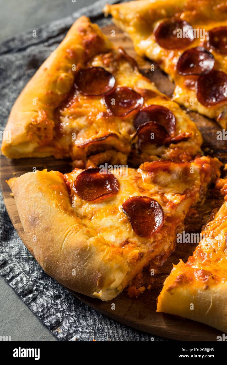 Homemade Pepperoni Stuffed Crust Pizza with Cheese Stock Photo - Alamy