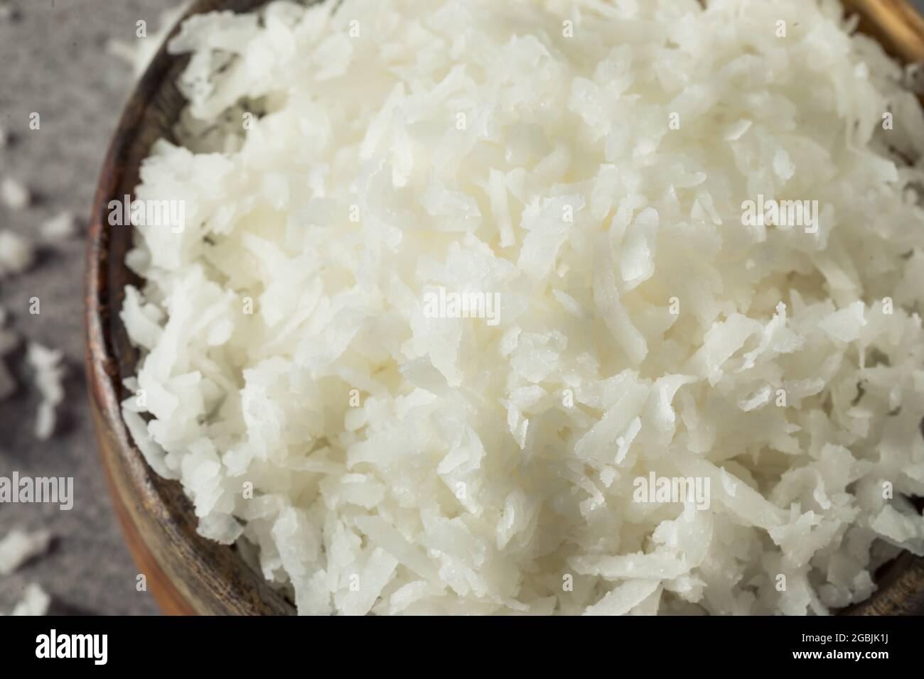 Raw Organic Shredded Coconut Flakes in a Bowl Stock Photo - Alamy