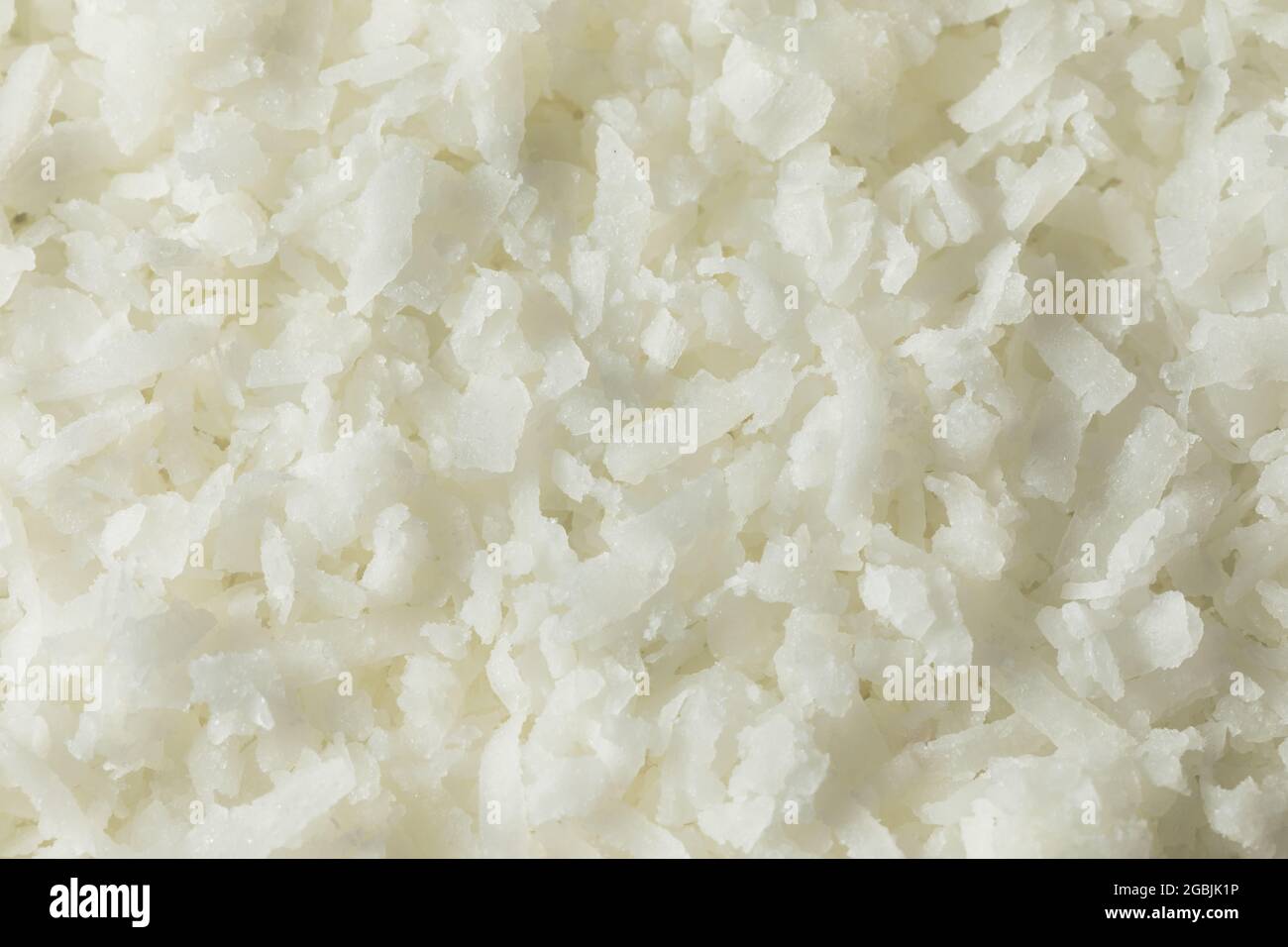 Raw Organic Shredded Coconut Flakes in a Bowl Stock Photo - Alamy