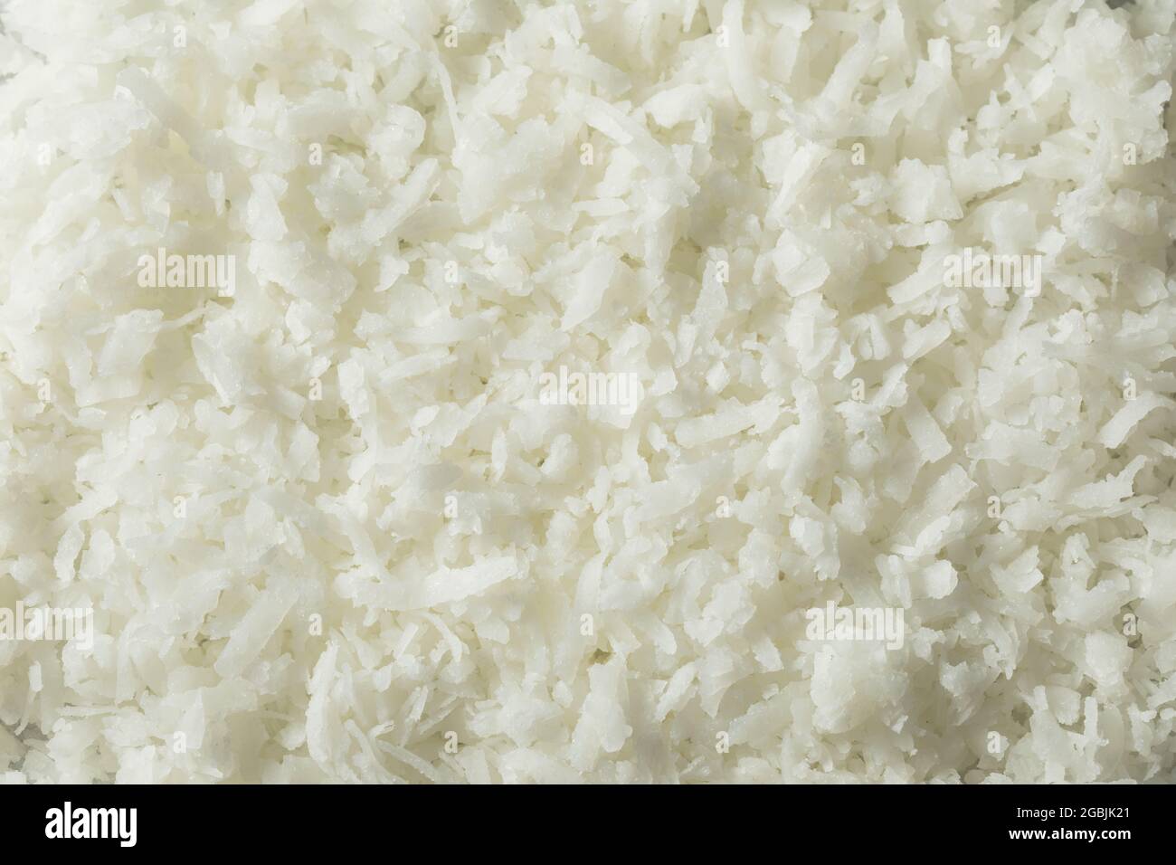 Raw Organic Shredded Coconut Flakes in a Bowl Stock Photo - Alamy
