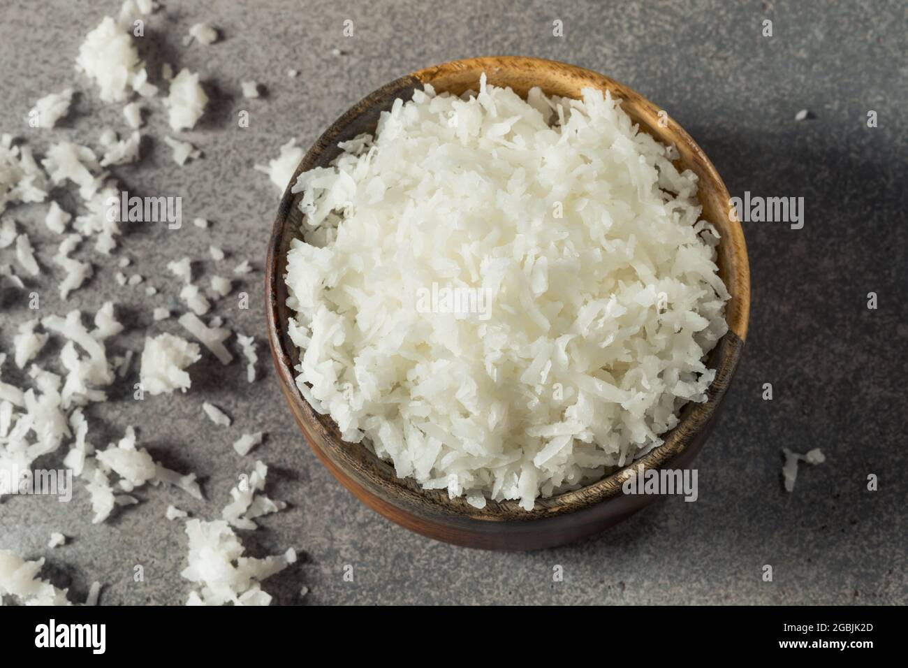 Raw Organic Shredded Coconut Flakes in a Bowl Stock Photo - Alamy