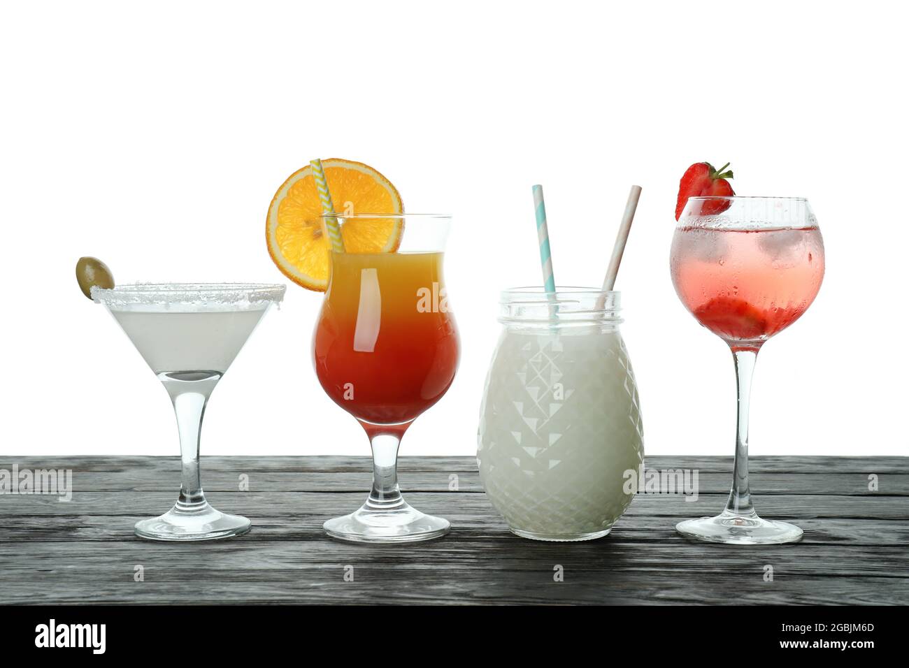 Different cocktails on wooden table isolated on white background Stock ...