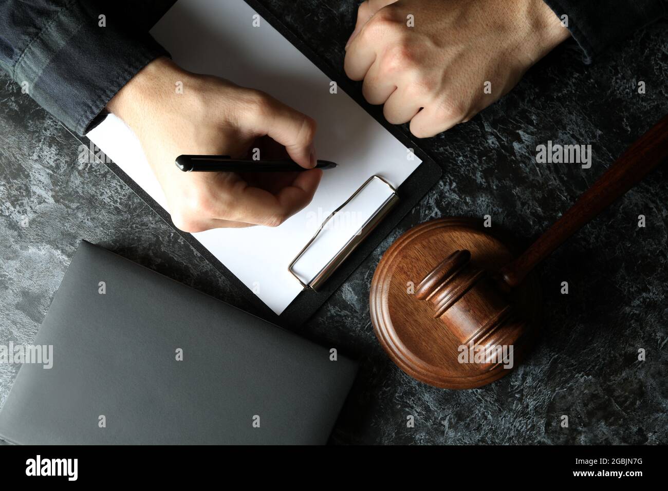 Judge make notes in clipboard, law concept, close up Stock Photo - Alamy