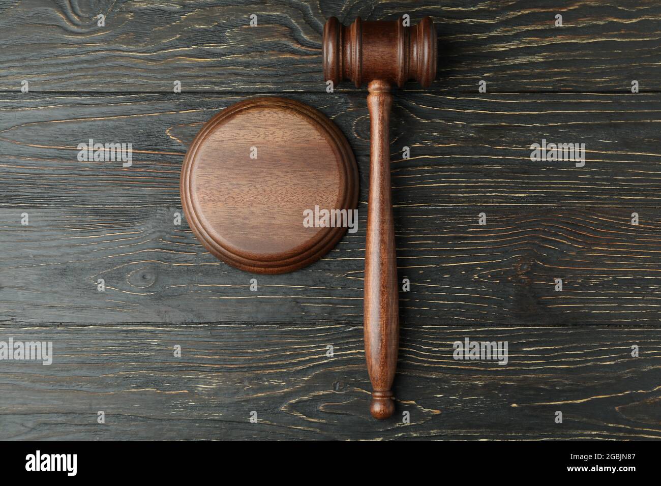 Judge gavel on rustic wooden background, top view Stock Photo - Alamy