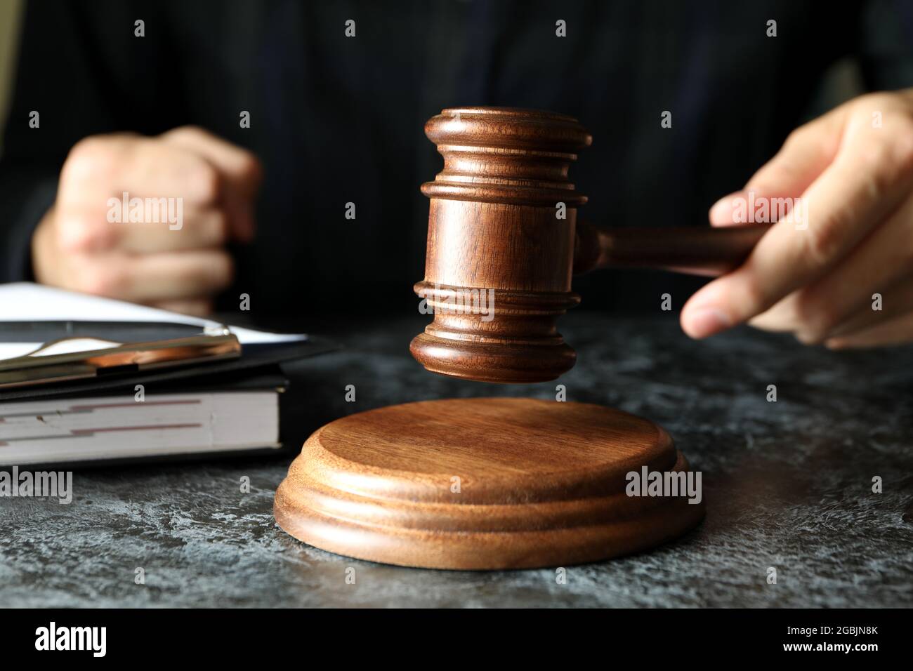 Judge hits hammer, close up, law concept Stock Photo - Alamy