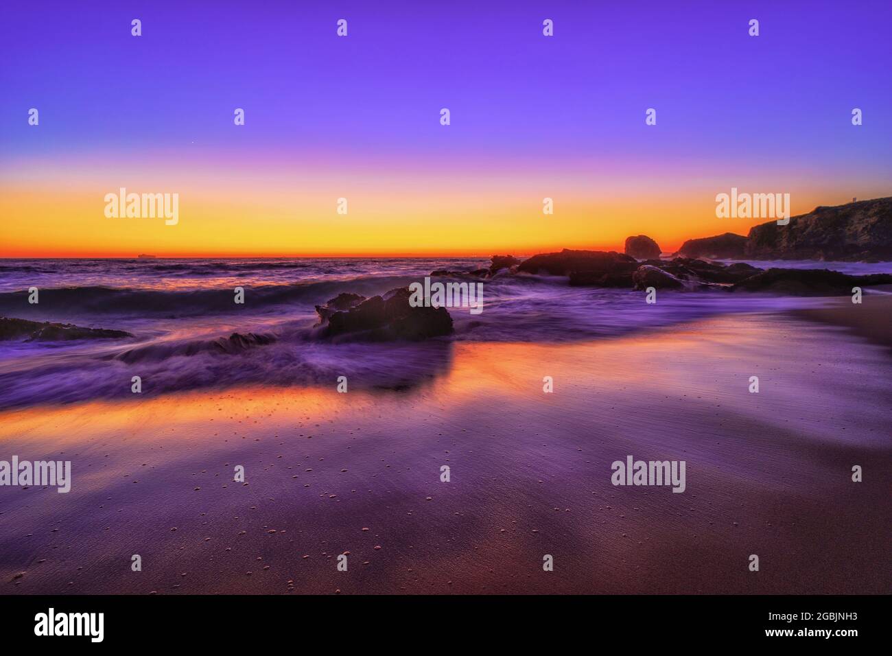 Beautiful scenery of cliffs by the sea at sunset Stock Photo - Alamy