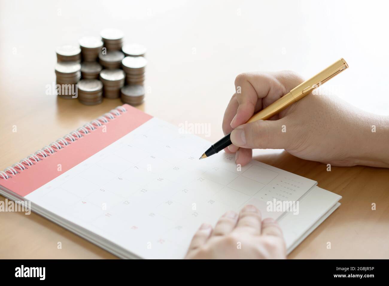 Close up hand writing in calendar plan concept Stock Photo - Alamy