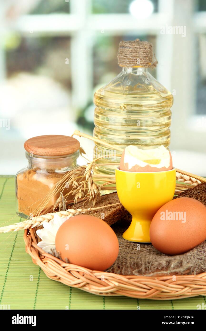 Boiled eggs on wicker matt on bright background Stock Photo - Alamy