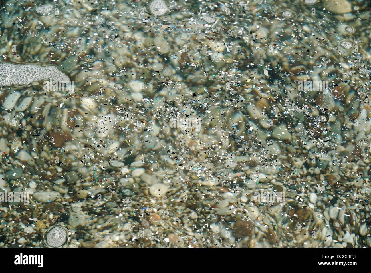 Microplastic pollution of the sea and the ocean. Plastic trash and ...