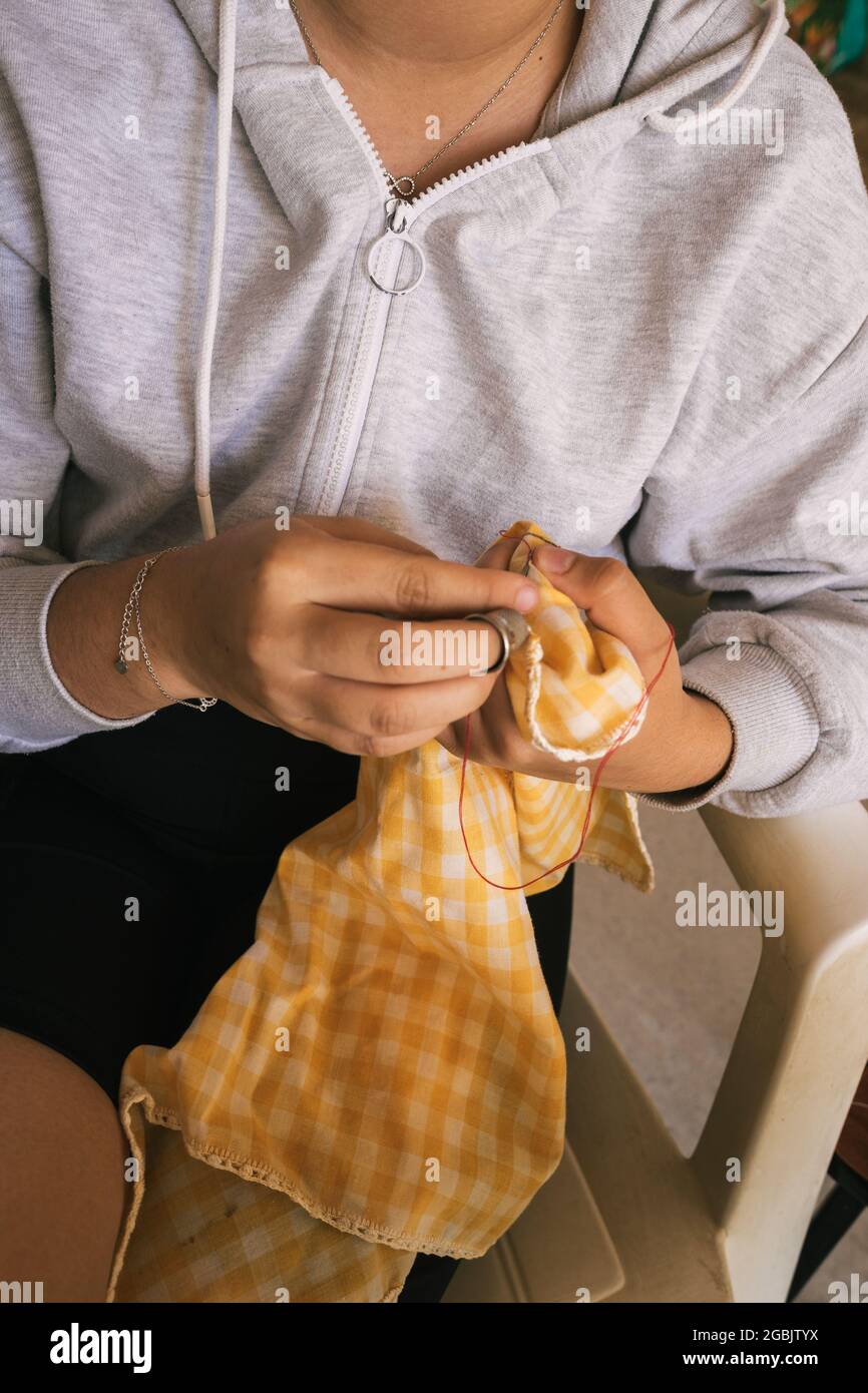 Young girl learning to sew Stock Photo - Alamy