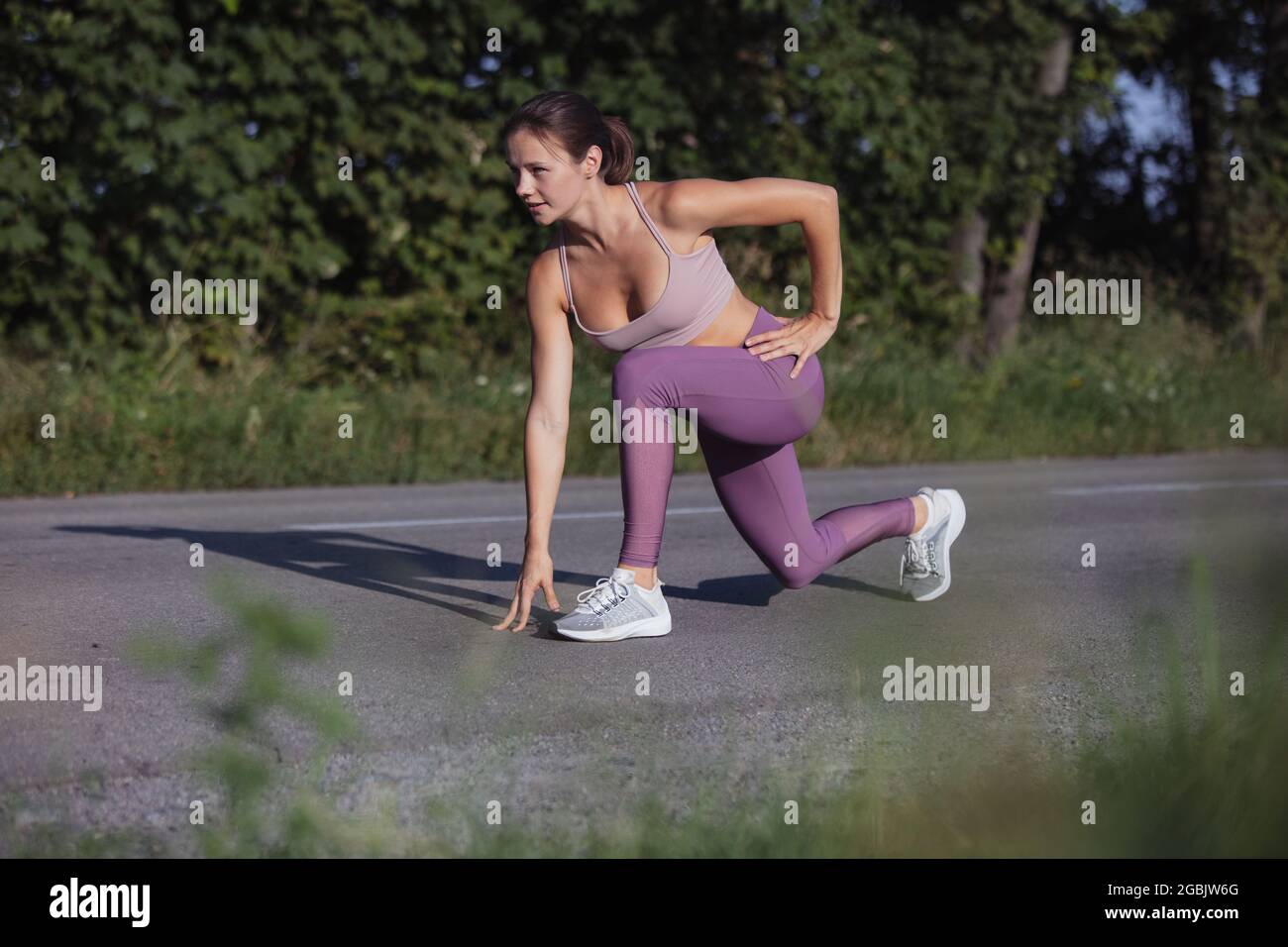 Image of one young slim sportive caucasian woman working out, doing ...