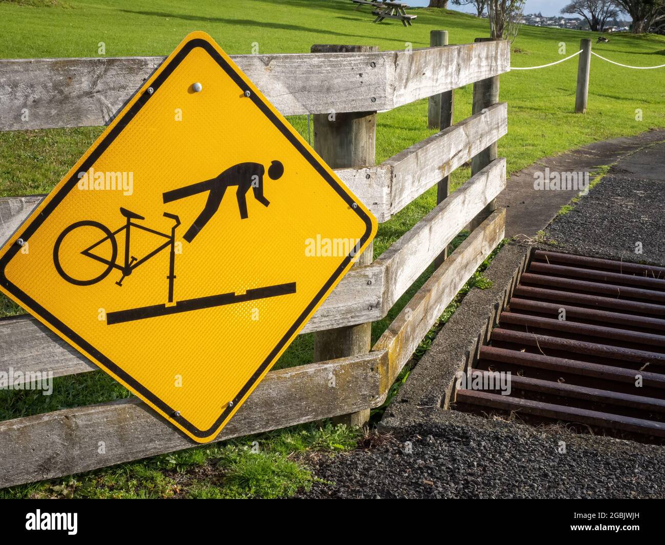 Cyclists take care on rail tracks W15-11 sign Stock Photo - Alamy