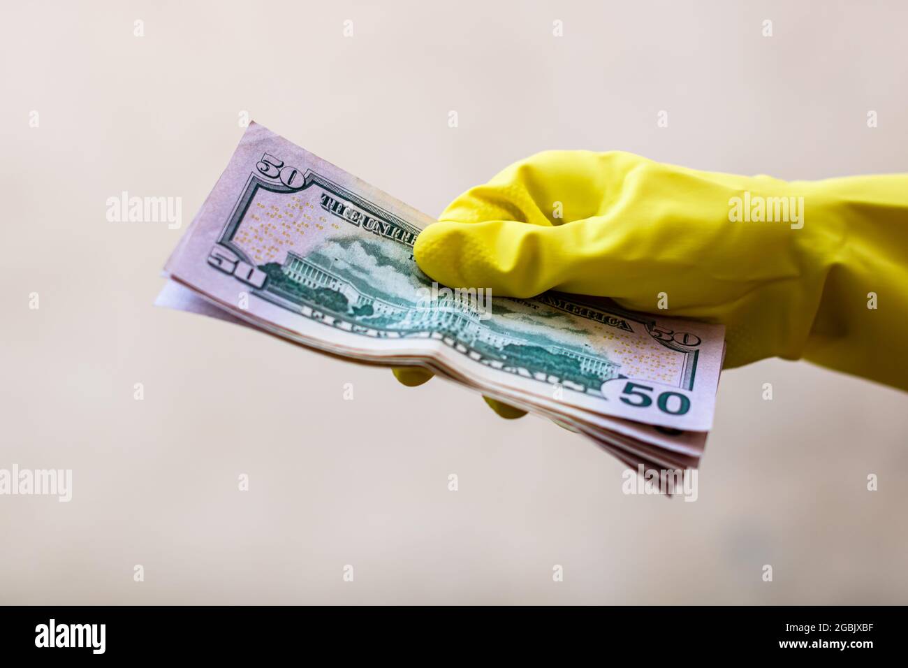 Hand with gloves receiving, giving or holding USD EURO banknote. World ...