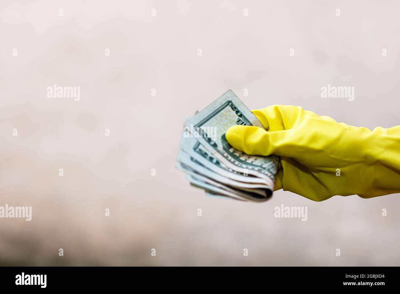 Hand with gloves receiving, giving or holding USD EURO banknote. World ...