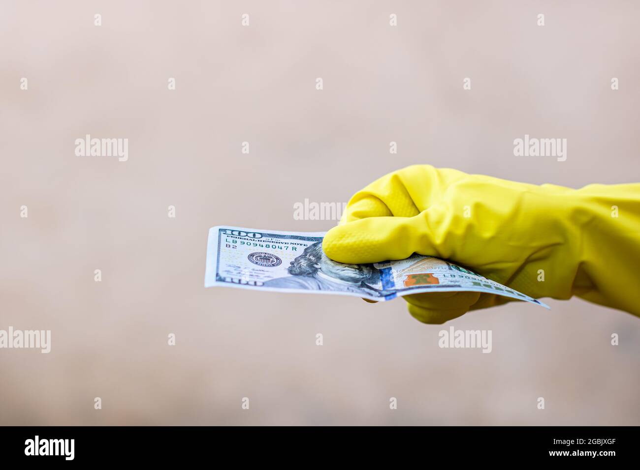 Hand with gloves receiving, giving or holding USD EURO banknote. World ...