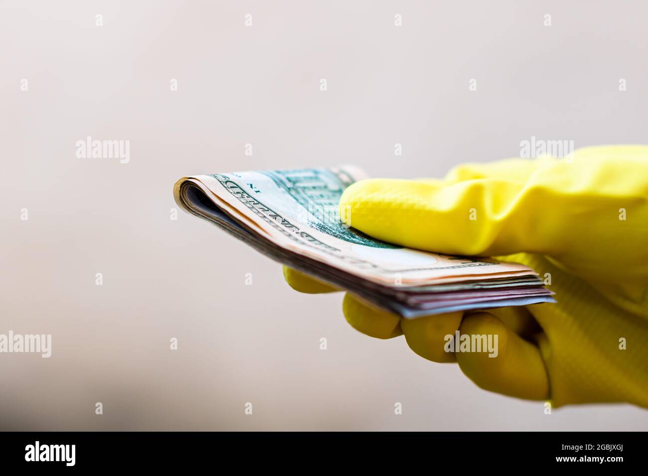 Hand with gloves receiving, giving or holding USD EURO banknote. World ...