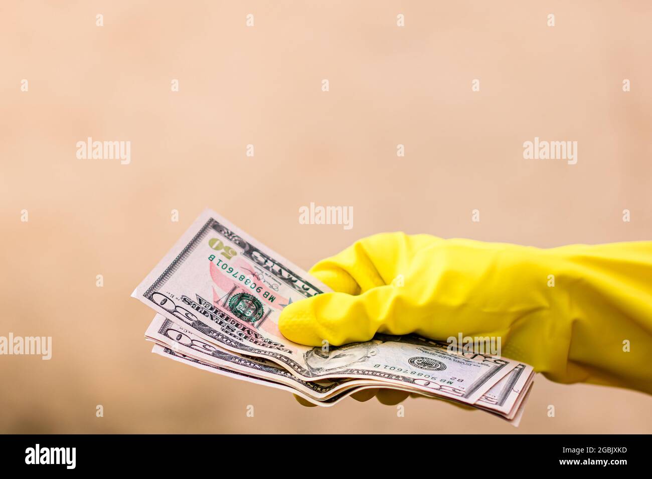 Hand with gloves receiving, giving or holding USD EURO banknote. World ...