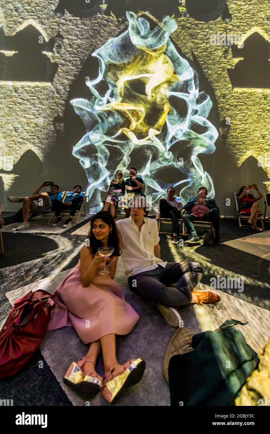 London, UK. 3rd Aug, 2021. The main room with a rolling projection of ...