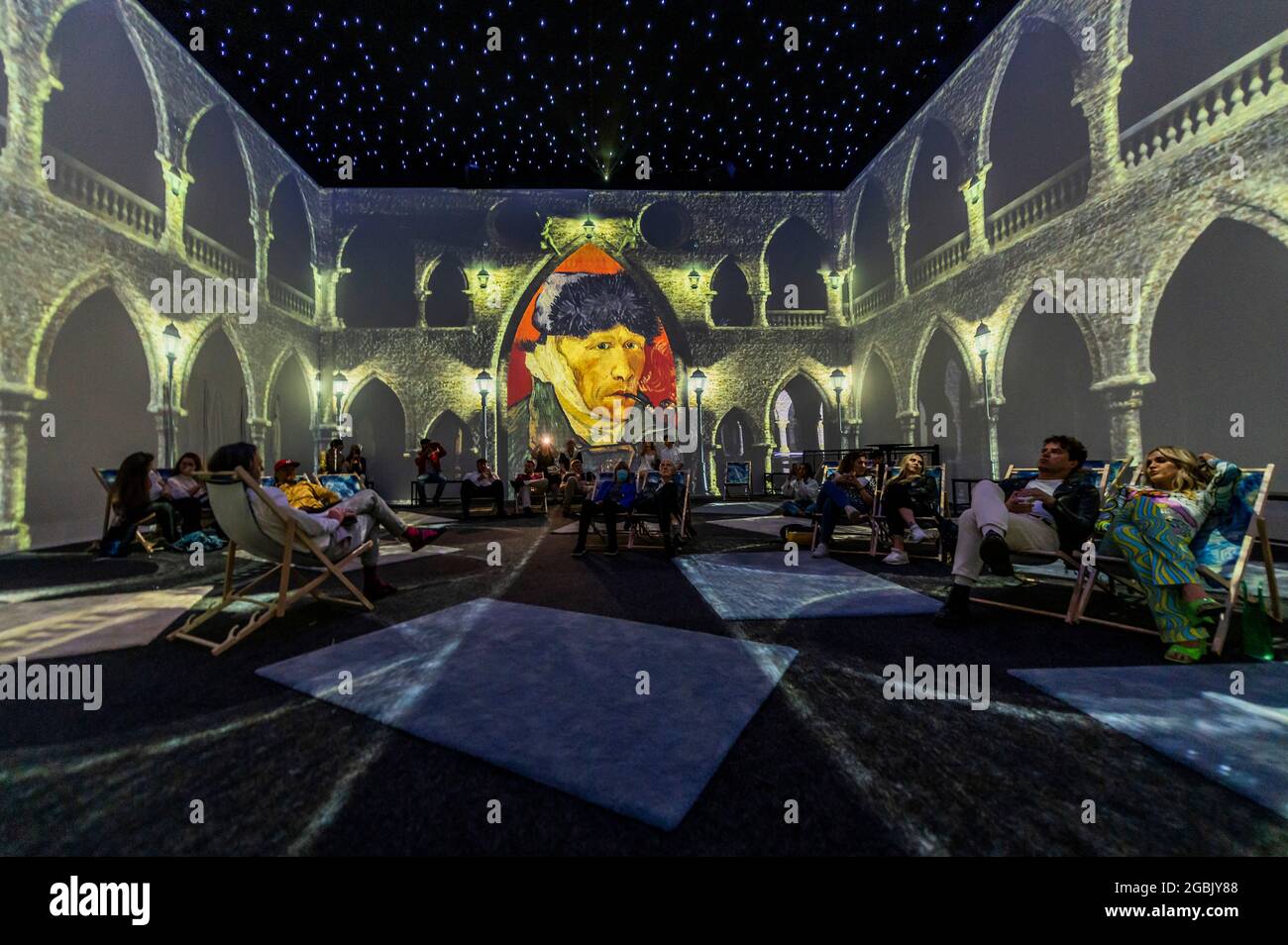 London, UK. 3rd Aug, 2021. The main room with a rolling projection of ...