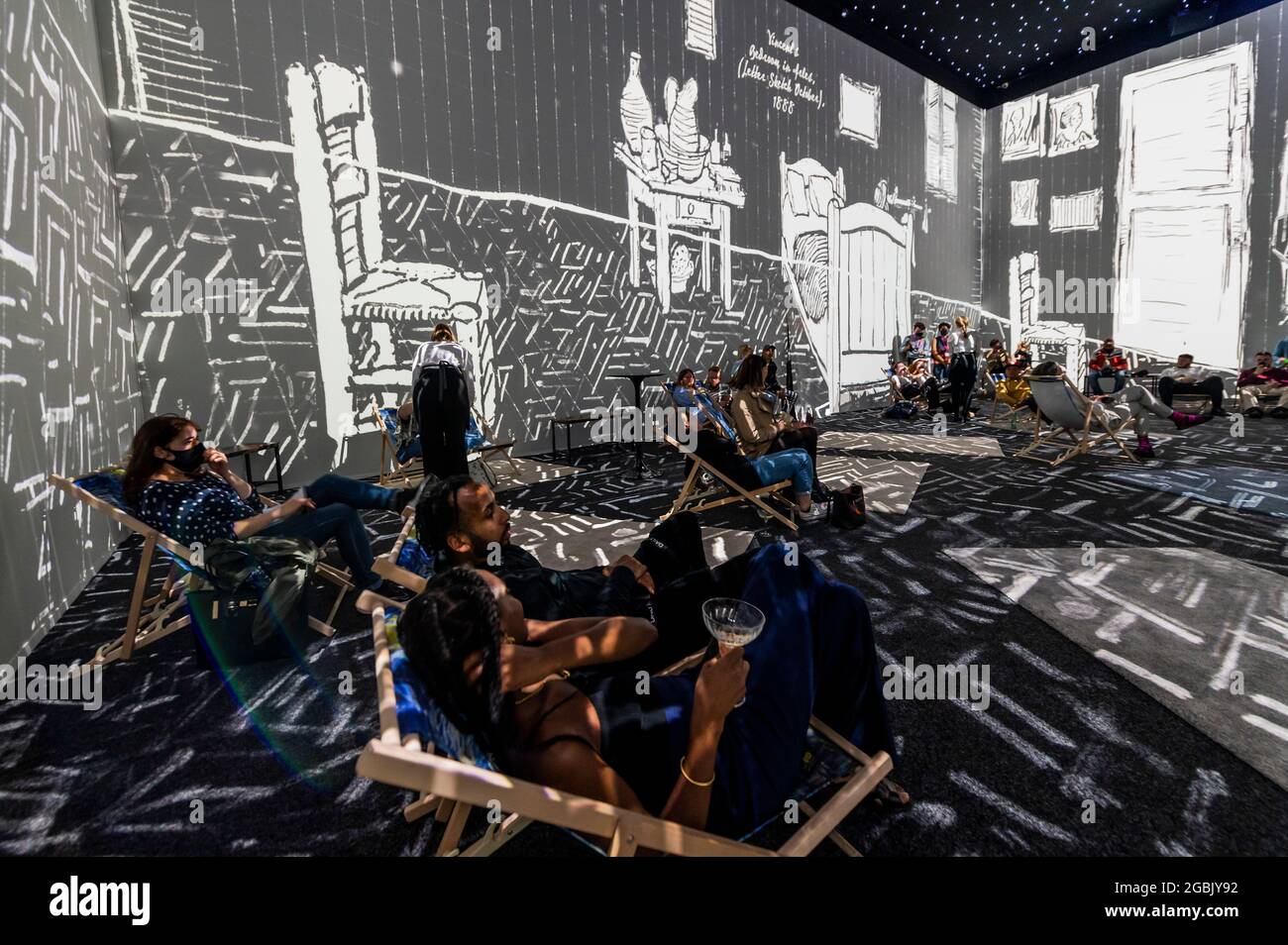 London, UK. 3rd Aug, 2021. The main room with a rolling projection of ...