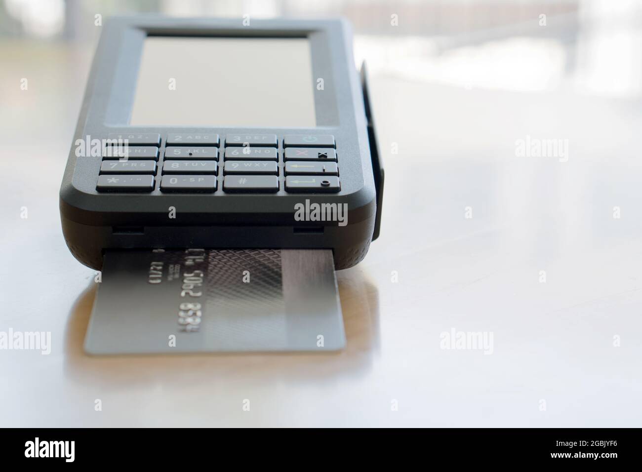 Payment terminal and credit card Stock Photo - Alamy