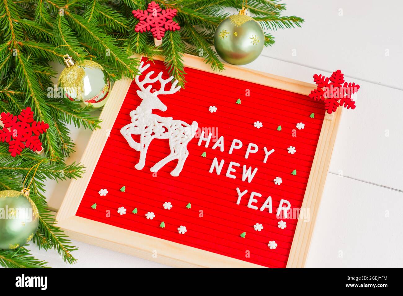 Flat lay with congratulation Happy New Year 2022 on letters board. Top ...