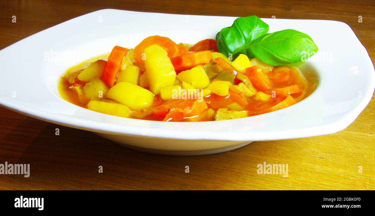 Self-made vegetable stew with basil Stock Photo - Alamy