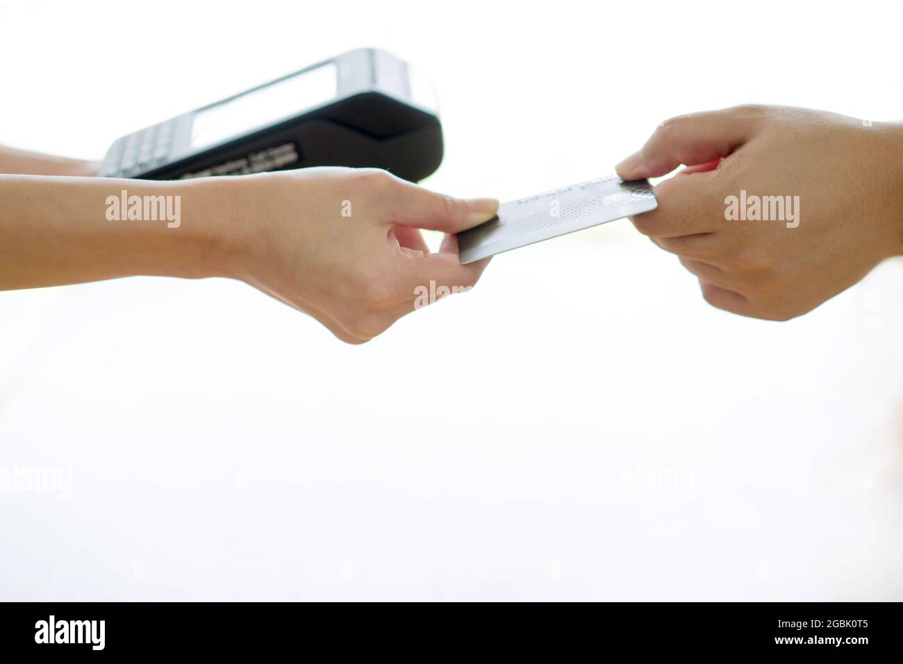Cashier receiving credit card Stock Photo - Alamy