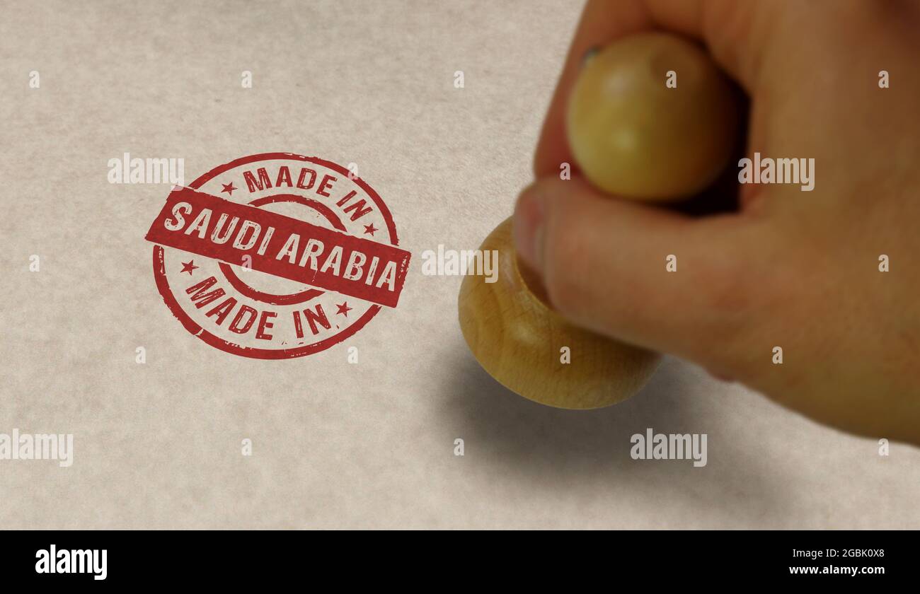 Made in Saudi Arabia stamp and stamping hand. Factory, manufacturing ...
