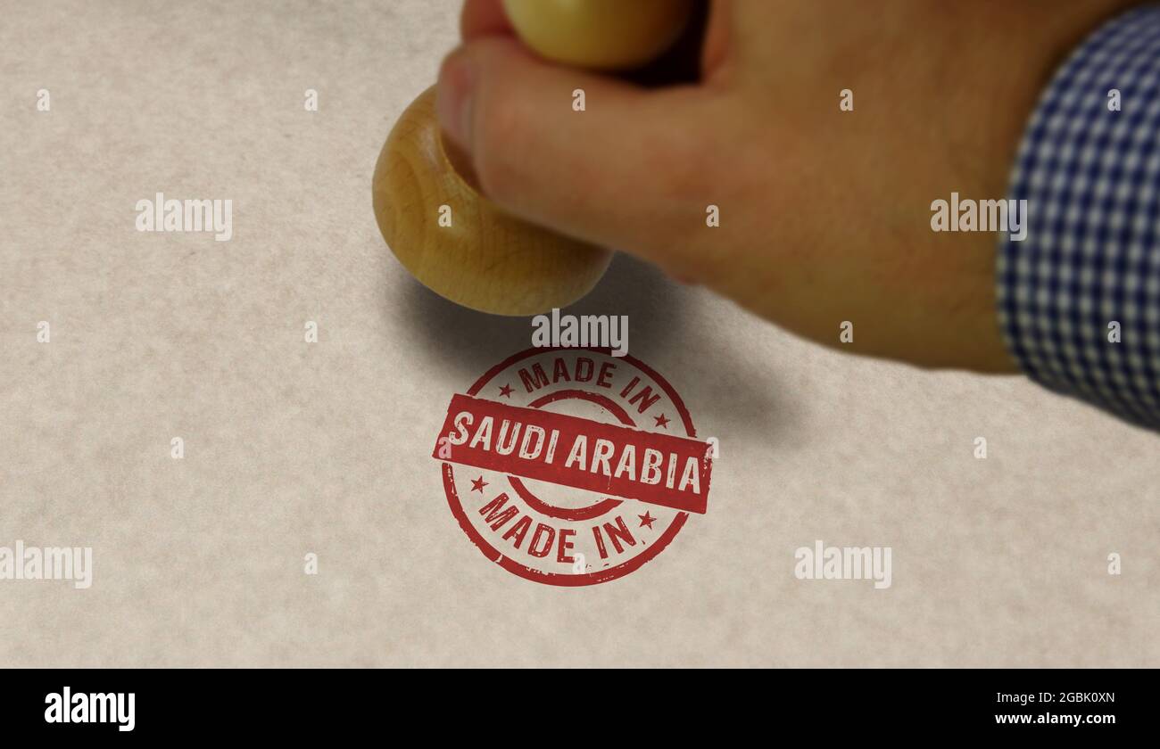Made in Saudi Arabia stamp and stamping hand. Factory, manufacturing ...