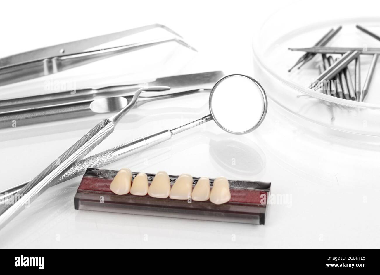 denture with dental tools isolated on white Stock Photo - Alamy