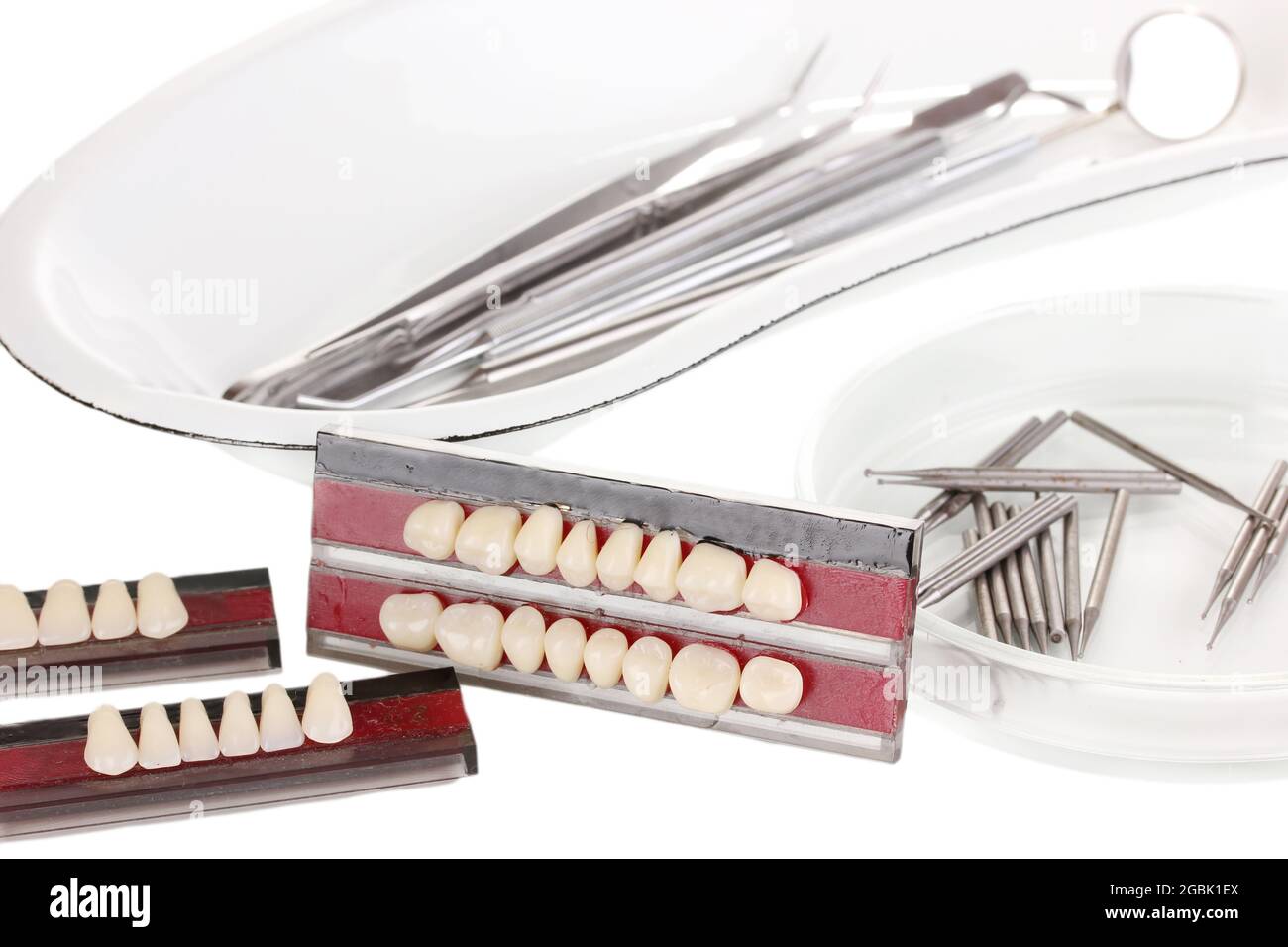 denture with dental tools isolated on white Stock Photo - Alamy