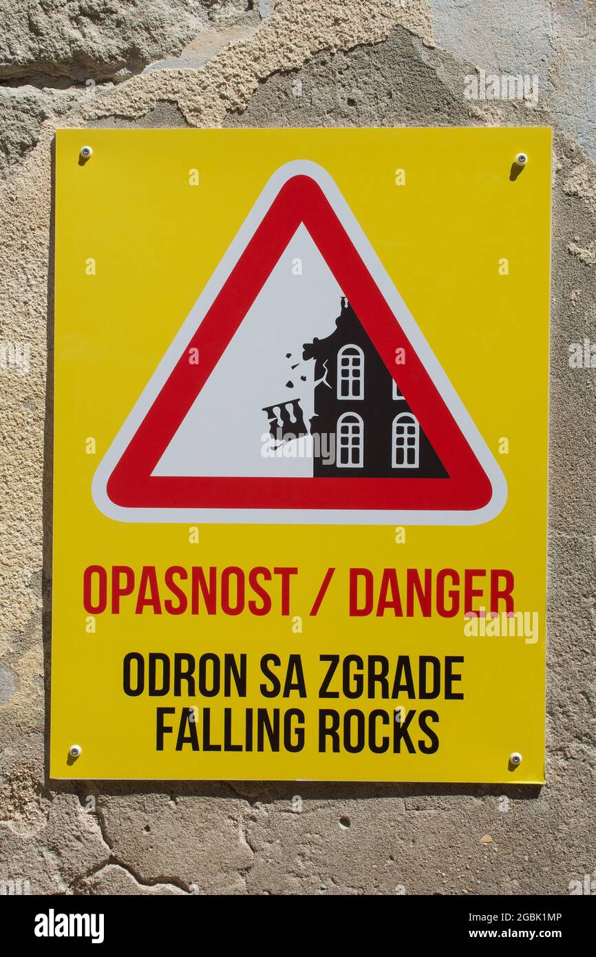 A sign on a derelict house warning people that the house is a danger ...