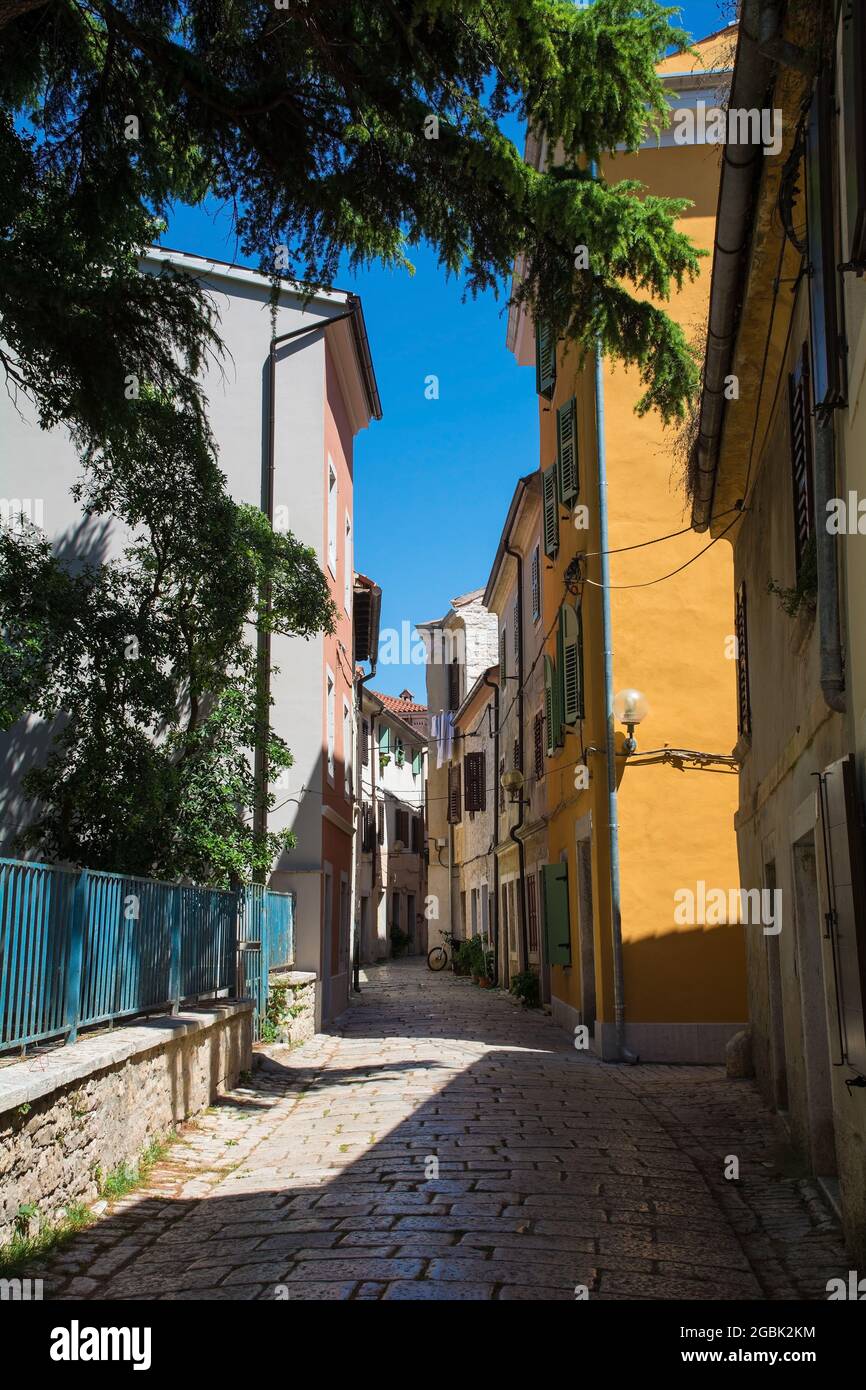 A quiet back street in the historic medieval coastal town of Porec in ...