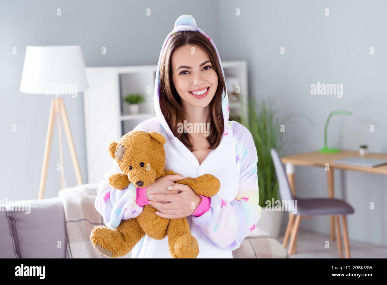 Photo of sincere genuine winsome candid adorable lady cuddle toy bear ...