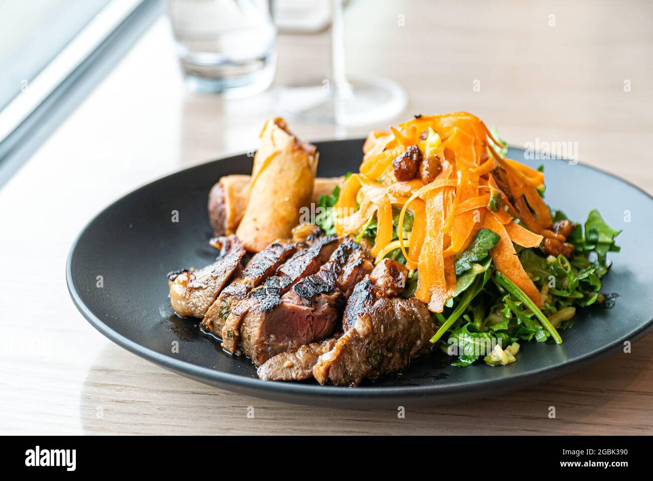 Grilled New York Steak Salad - Side View Stock Photo - Alamy