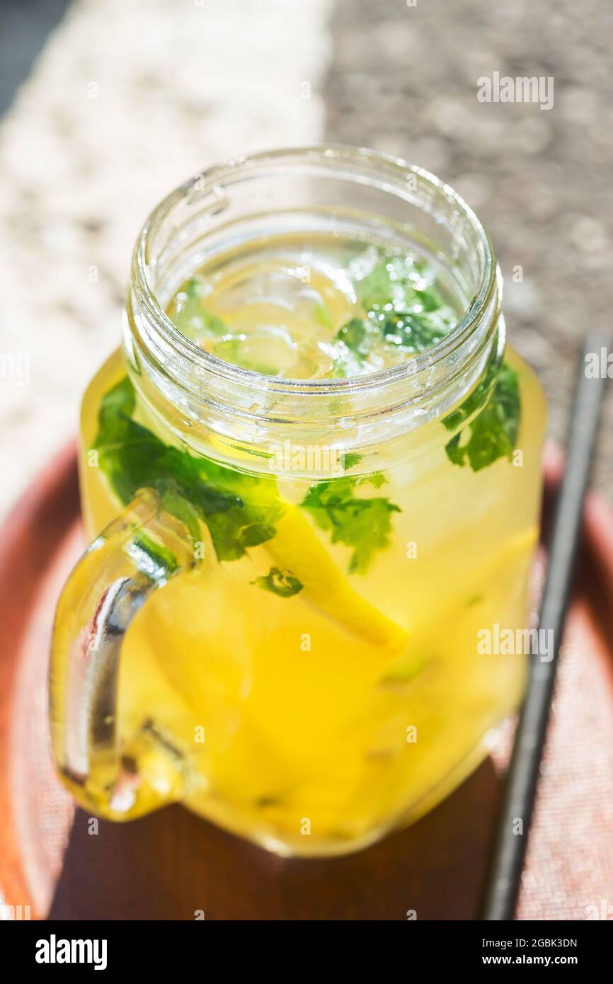 Ice cold fruit and mint tea with ice Stock Photo - Alamy